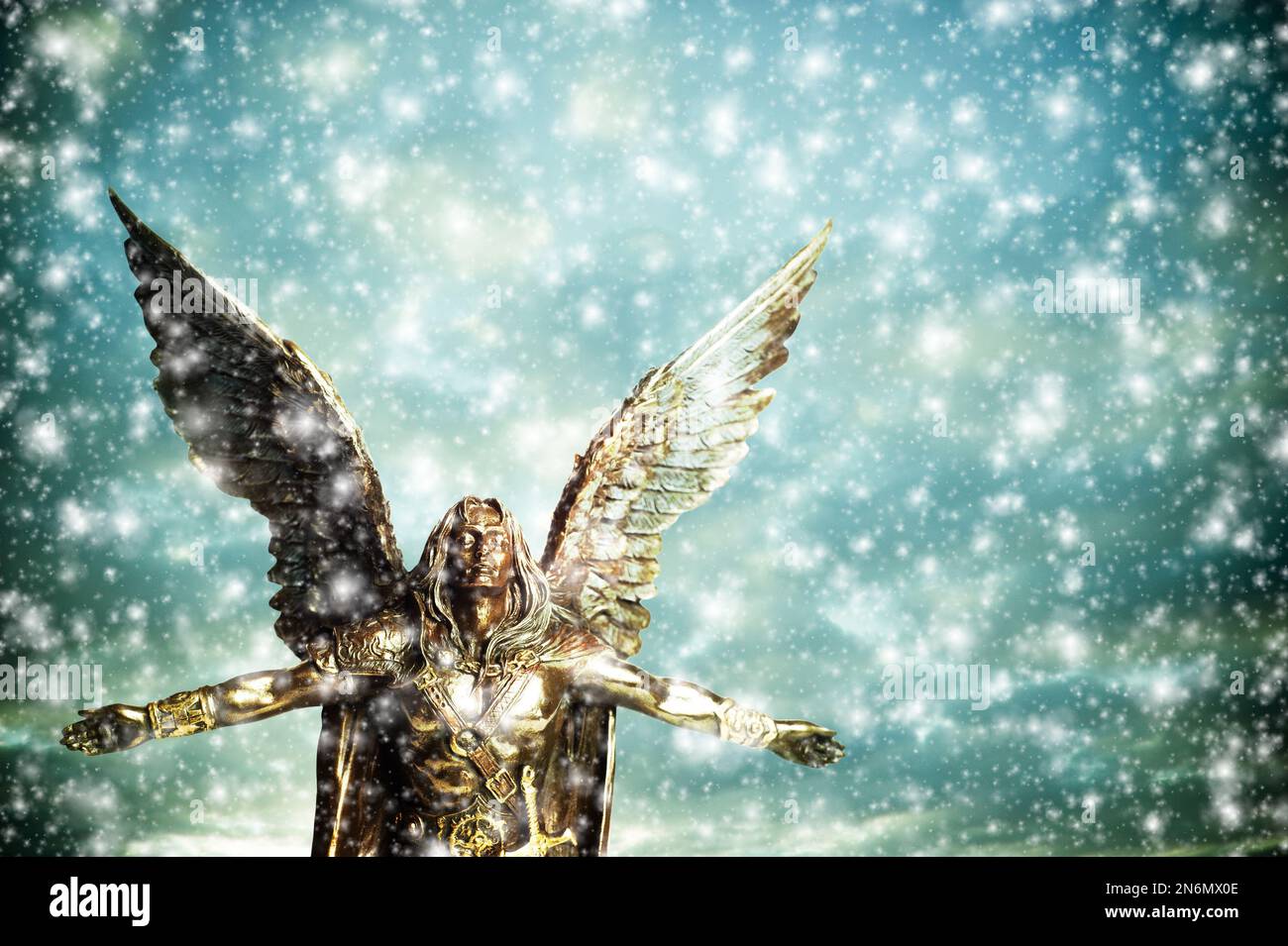 Archangel Michael statue with open arms and snow falling Stock Photo ...