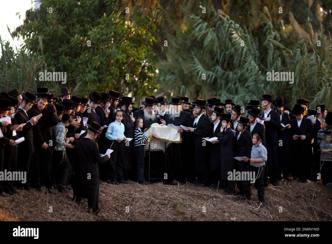 Ultra-Orthodox Jews gather for a prayer on the Hayarkon river banks as ...