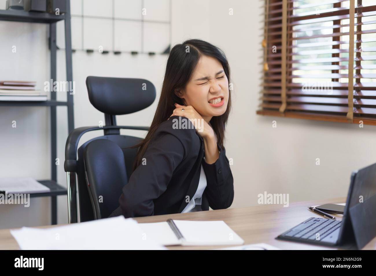 Secretary concept, Female secretary feeling shoulder pain from office ...
