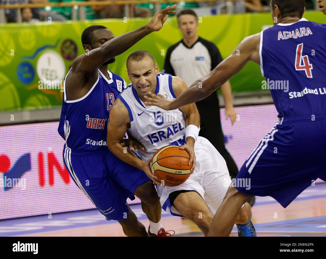 Israel's Afik Nissim challenges for the ball with Britain's Ogo ...