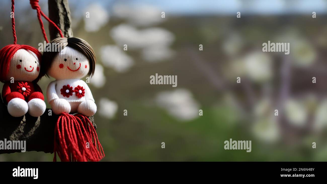 Traditional martenitsa dolls made from red and white yarn. Male and ...