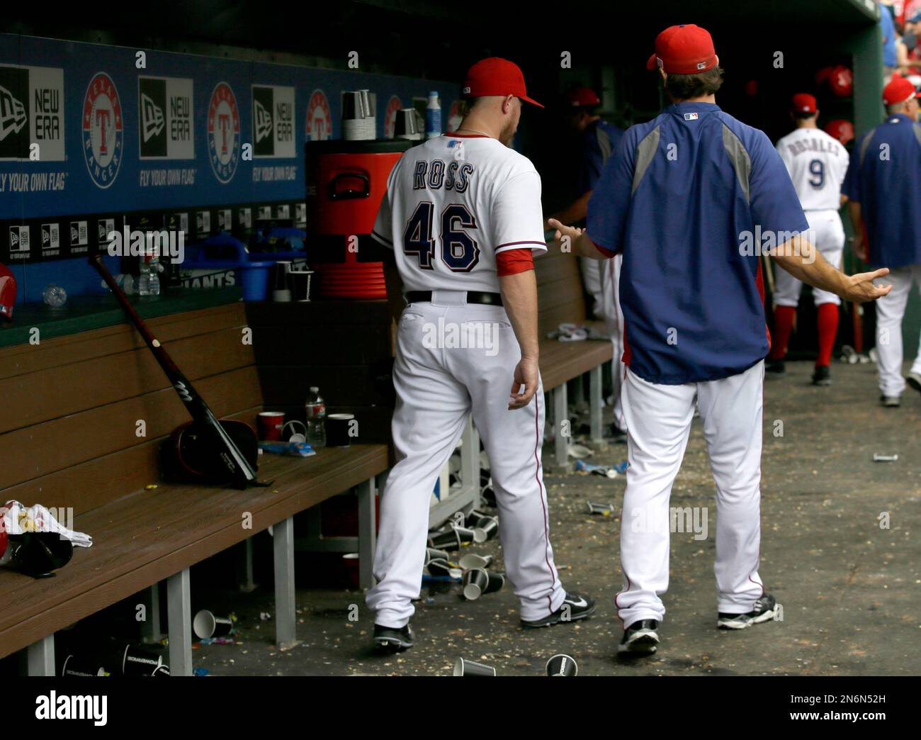 Texas Rangers' Robbie Ross (46) and Neal Cotts, right, walk out of the ...