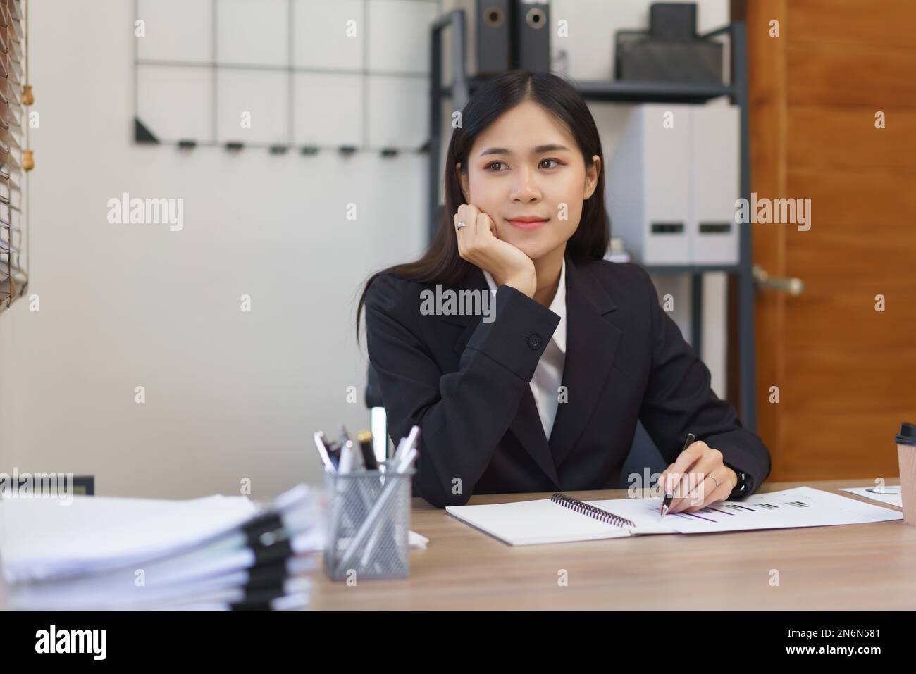 Secretary concept, Female secretary look outside to thinking something ...