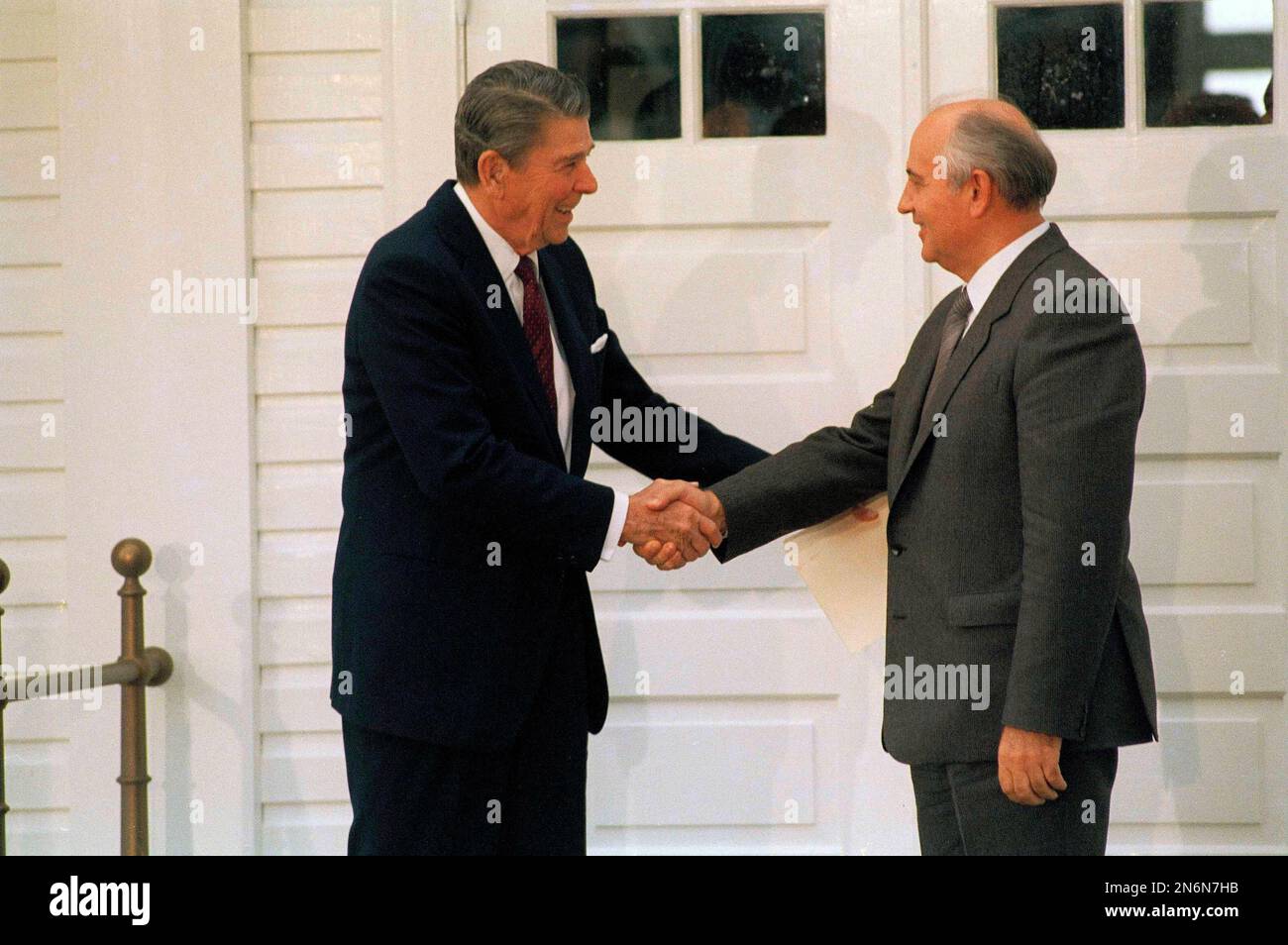 U.S. President Ronald Reagan and Soviet leader Mikhail Gorbachev shake ...