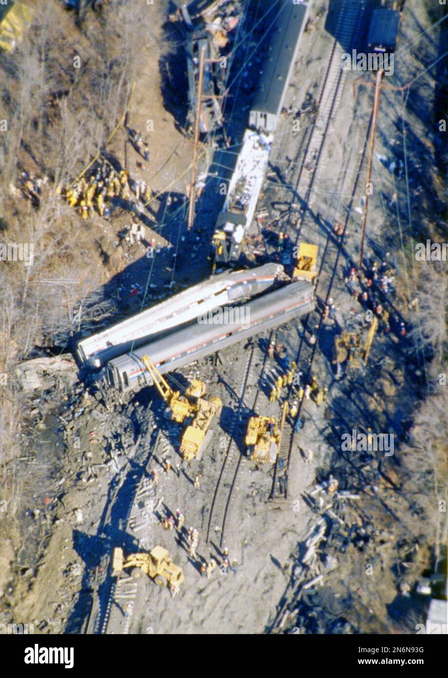 An aerial view of workmen searching the wreckage from the collision ...