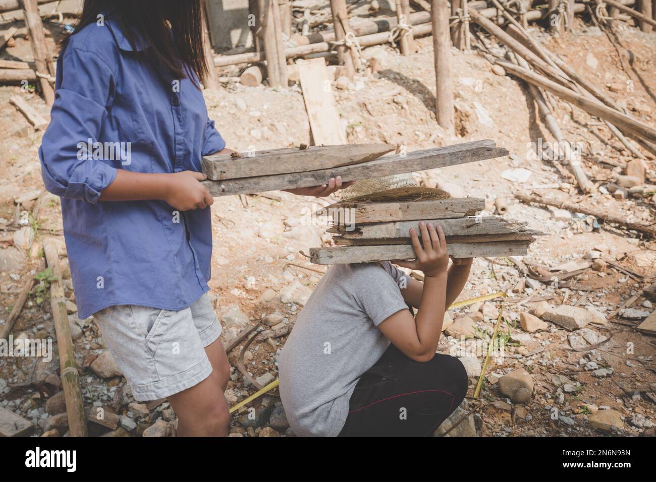 boys labor work in the construction site, Against child labor, Poor ...