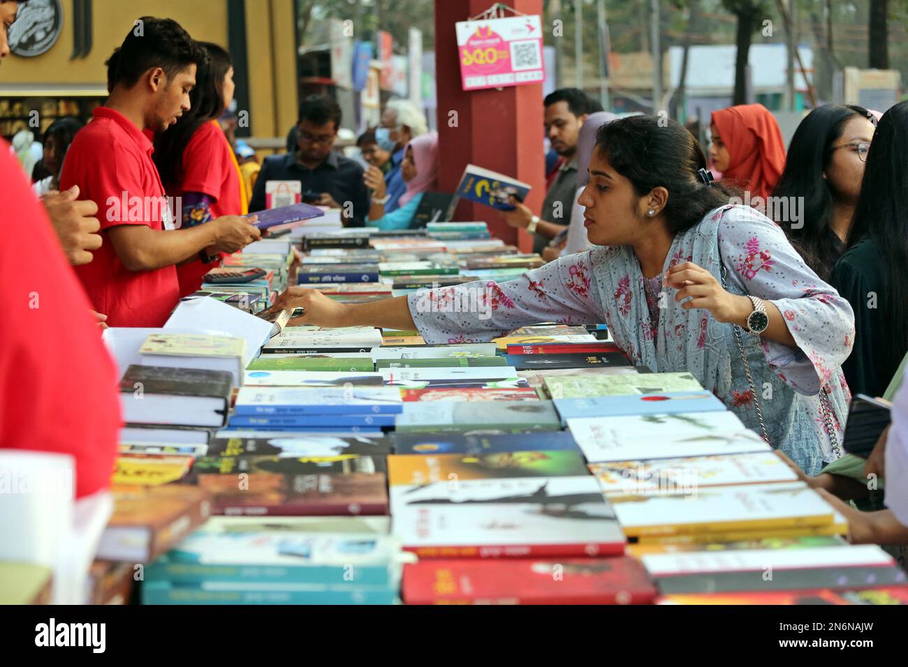 Dhaka, Bangladesh, February 9, 2023. Visitors read books at the ...