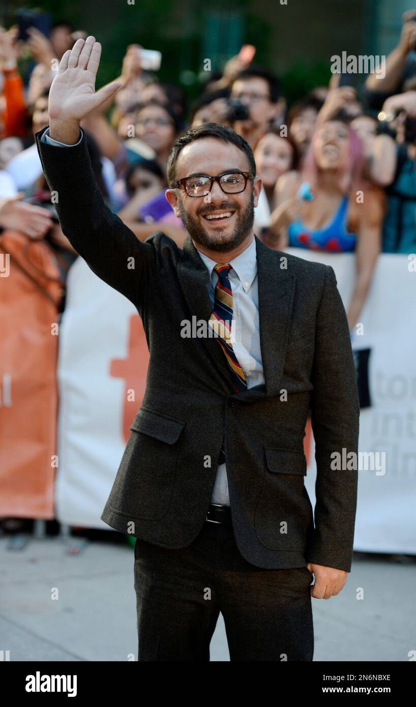 John Krokidas, director and co-writer of "Kill Your Darlings," waves at ...