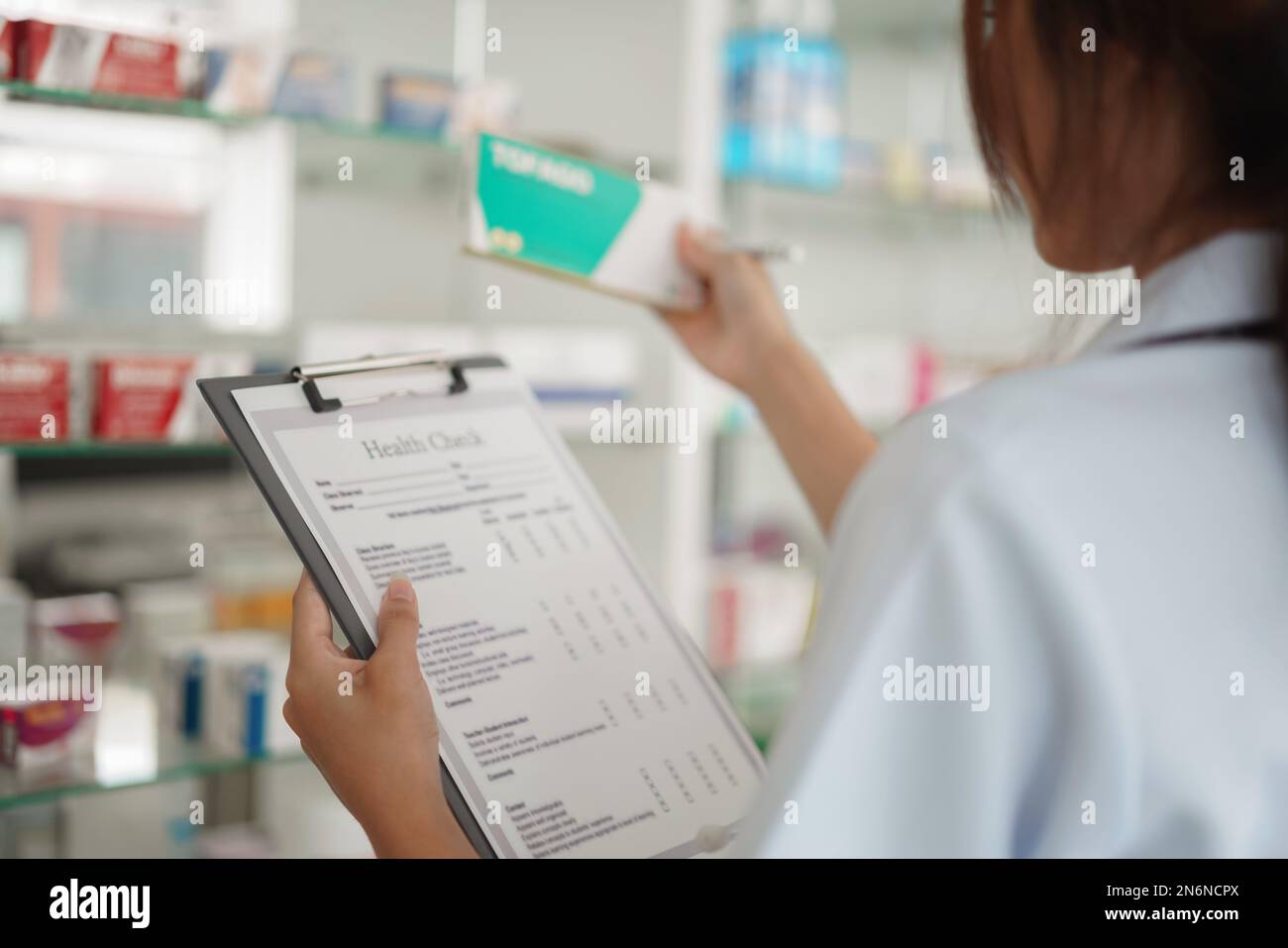 Medicine and health concept, Female pharmacist hold medicine box to ...