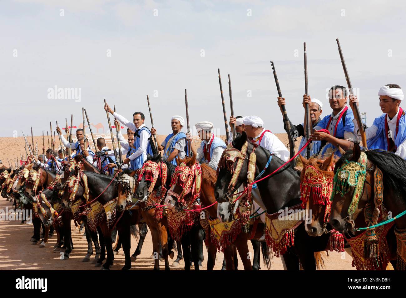 Riders on horses from the nomadic tribes of Saharan wait for the start ...