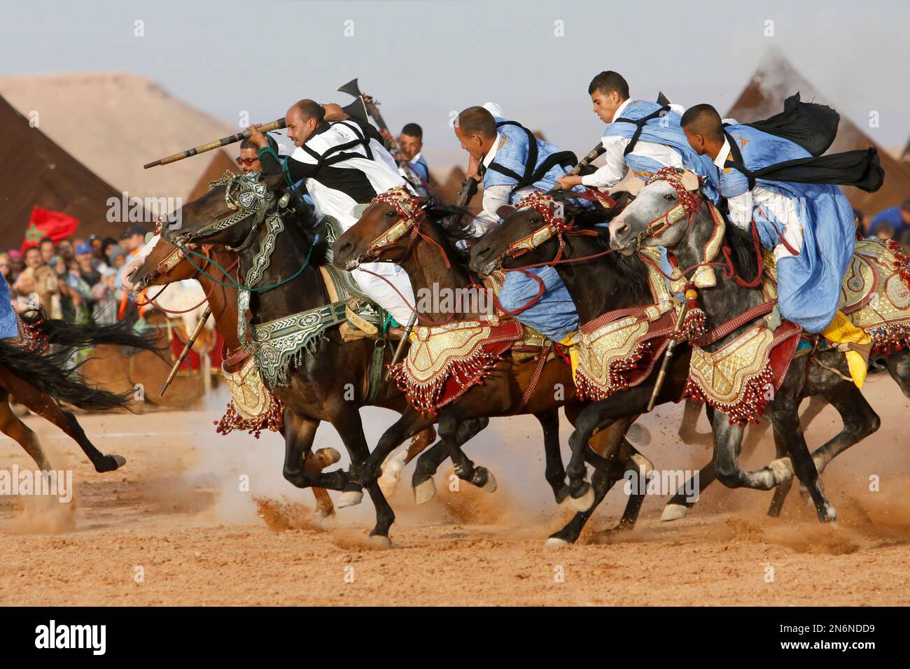 Riders from the nomadic tribes of Saharan perform the traditional ...