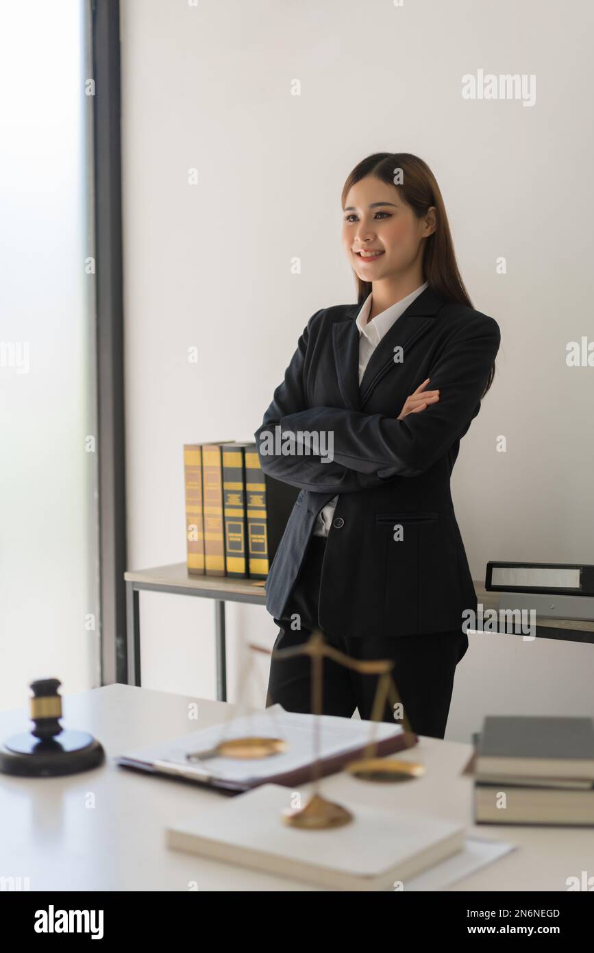 Law concept, Confident female lawyer standing with arms crossed and ...