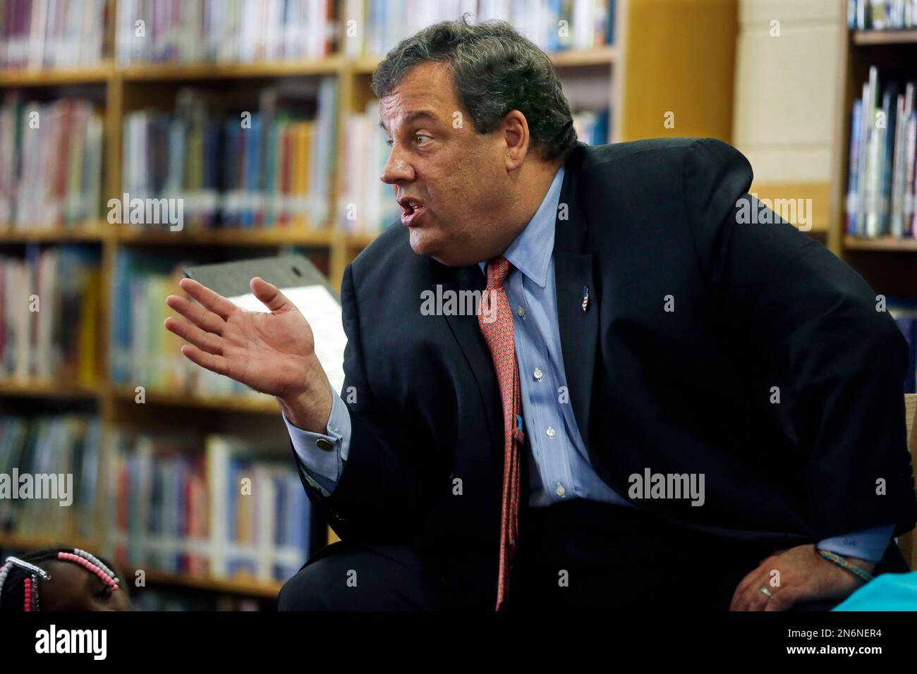 New Jersey Gov. Chris Christie, seated left, answers a question from an elementary school ...