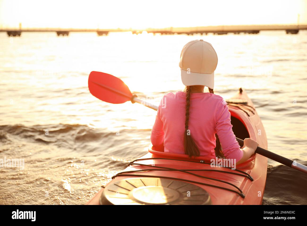 Little girl kayaking on river, back view. Summer camp activity Stock ...