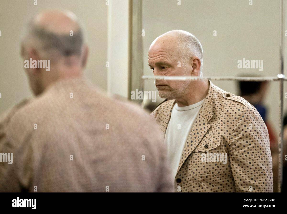 US actor John Malkovich is reflected in a mirror at the end of a press ...