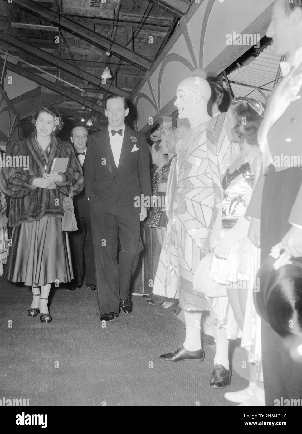 Britain's Princess Elizabeth, accompanied by Cyrus Mills, smiles as she ...