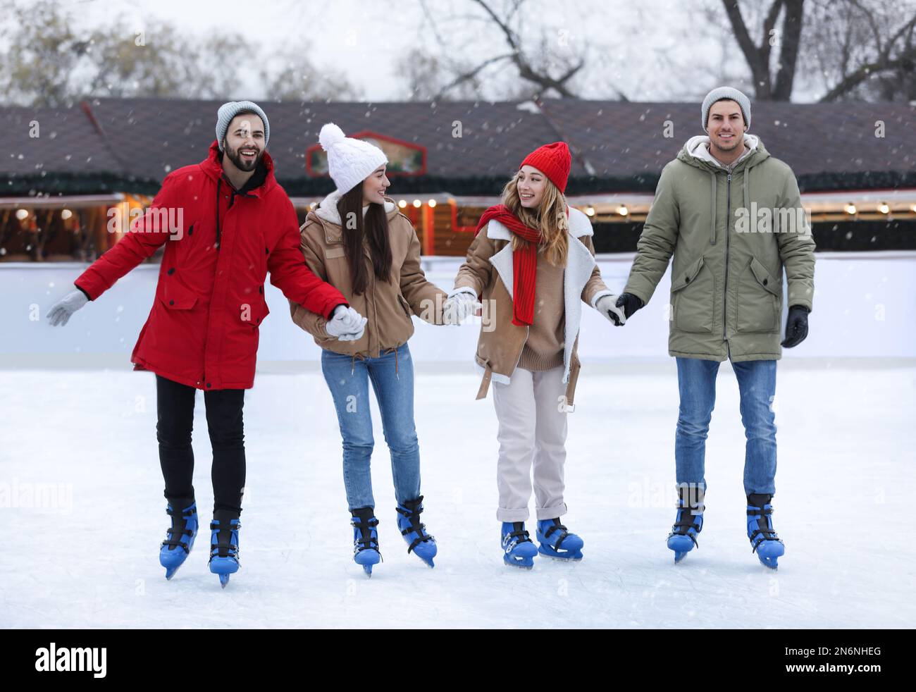 Group of friends at outdoor ice rink Stock Photo - Alamy