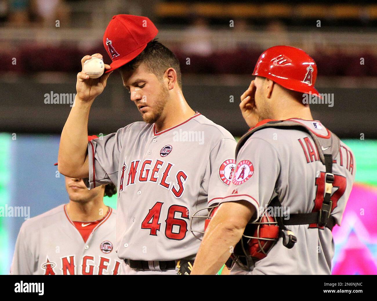 Los Angeles Angels pitcher Cory Rasmus (46) is dejected after giving up ...