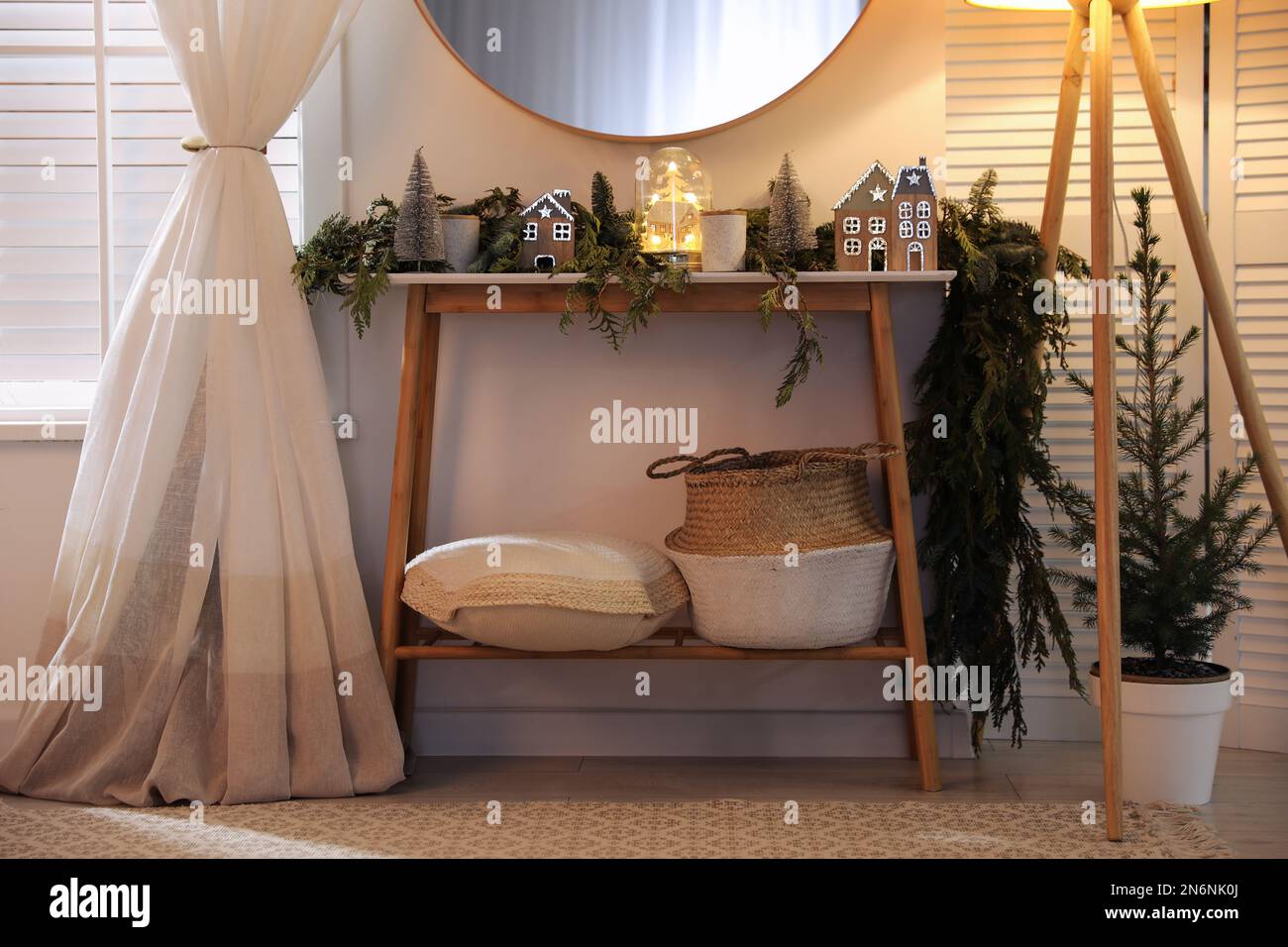 Stylish room interior with mirror and wooden console table near wall ...