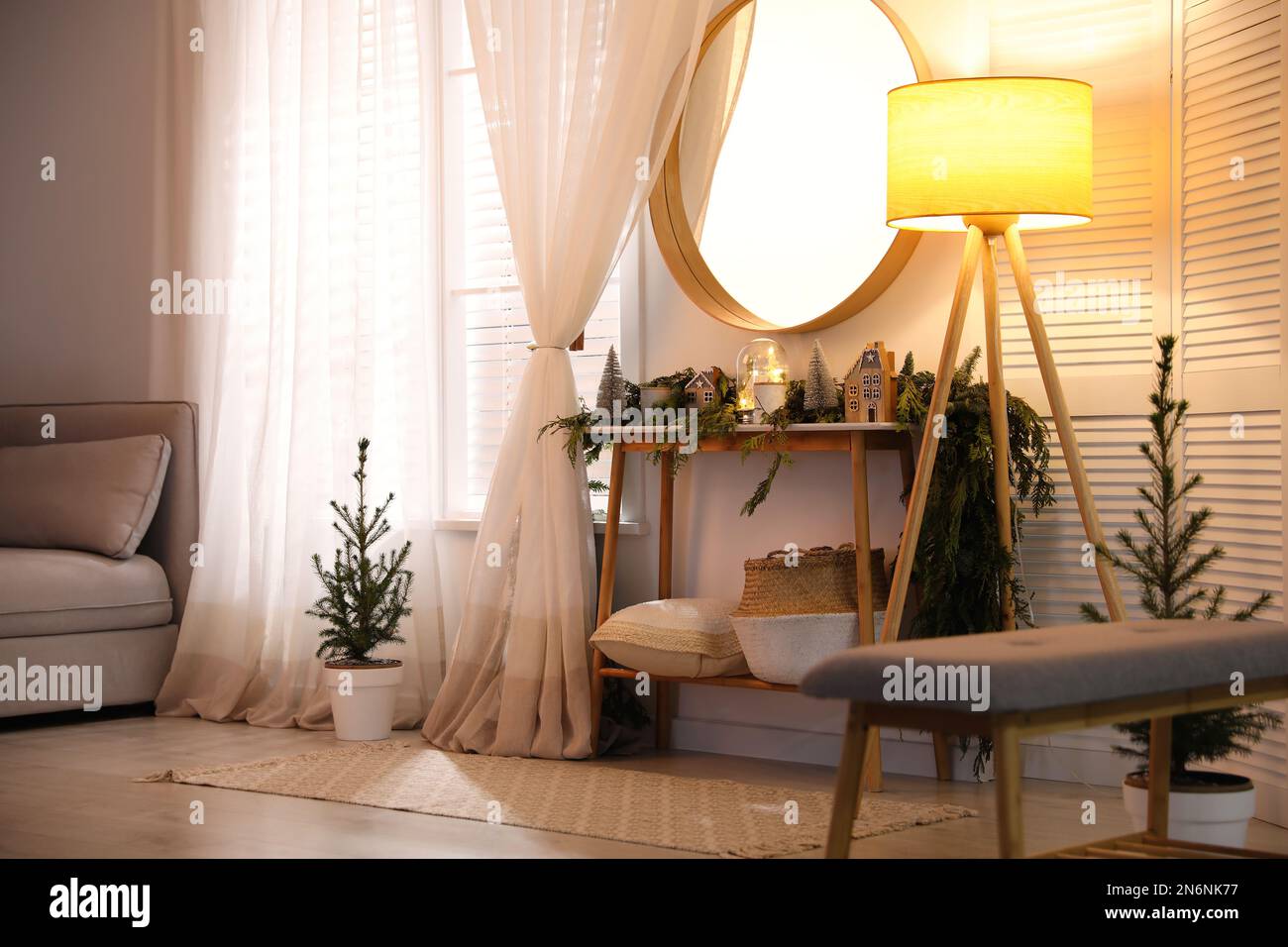 Stylish room interior with mirror and wooden console table near wall ...