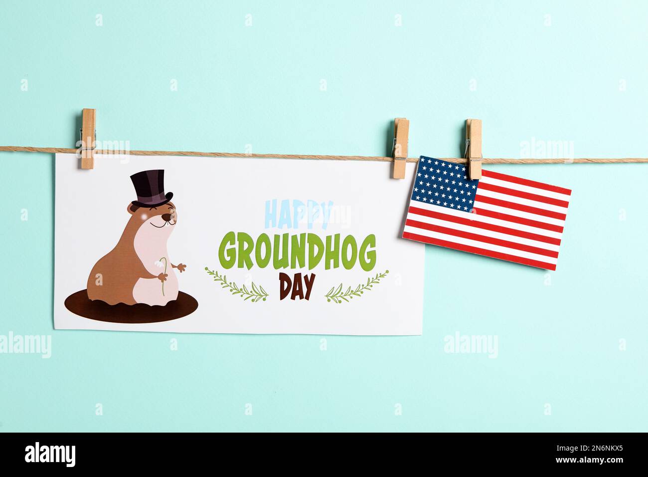 Happy Groundhog Day greeting card and American flag hanging on ...