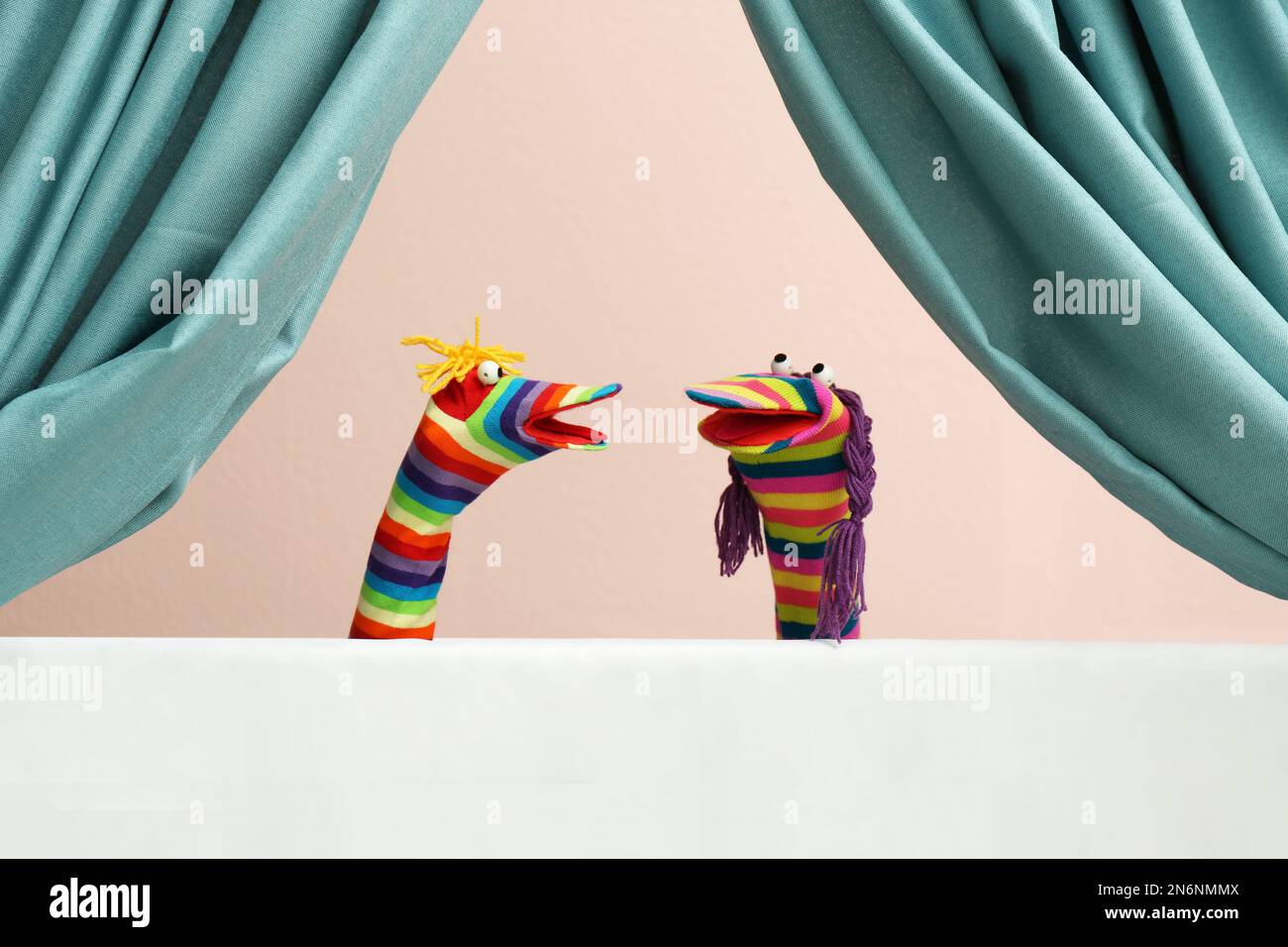 Creative puppet show on white stage indoors Stock Photo - Alamy