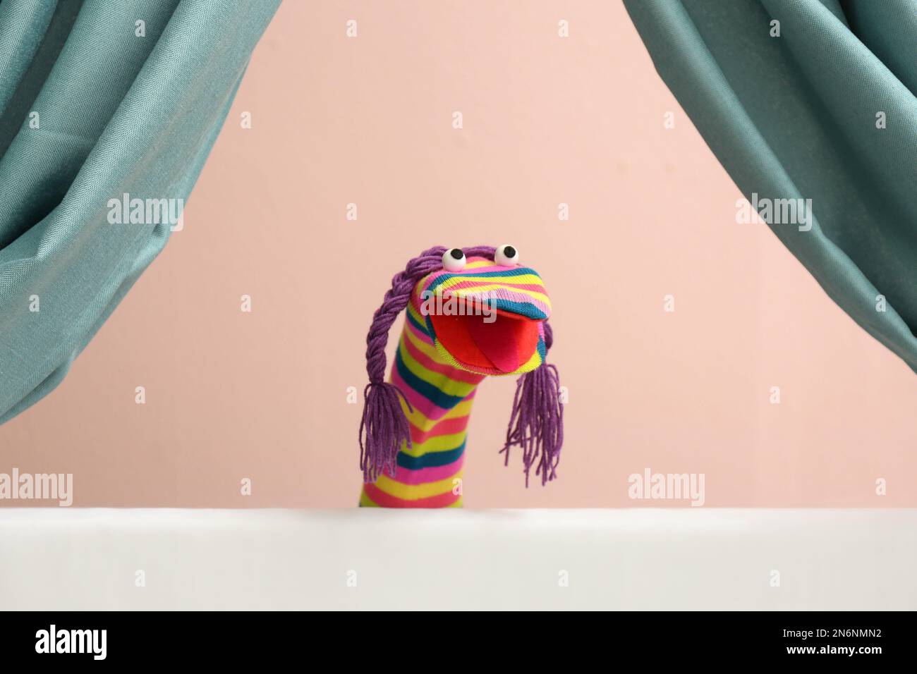 Creative puppet show on white stage indoors Stock Photo - Alamy
