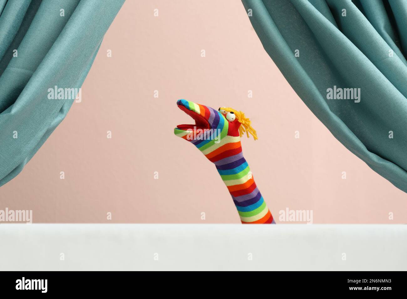 Creative puppet show on white stage indoors Stock Photo - Alamy