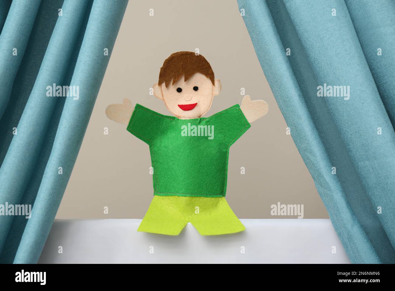 Creative puppet show on white stage indoors Stock Photo - Alamy