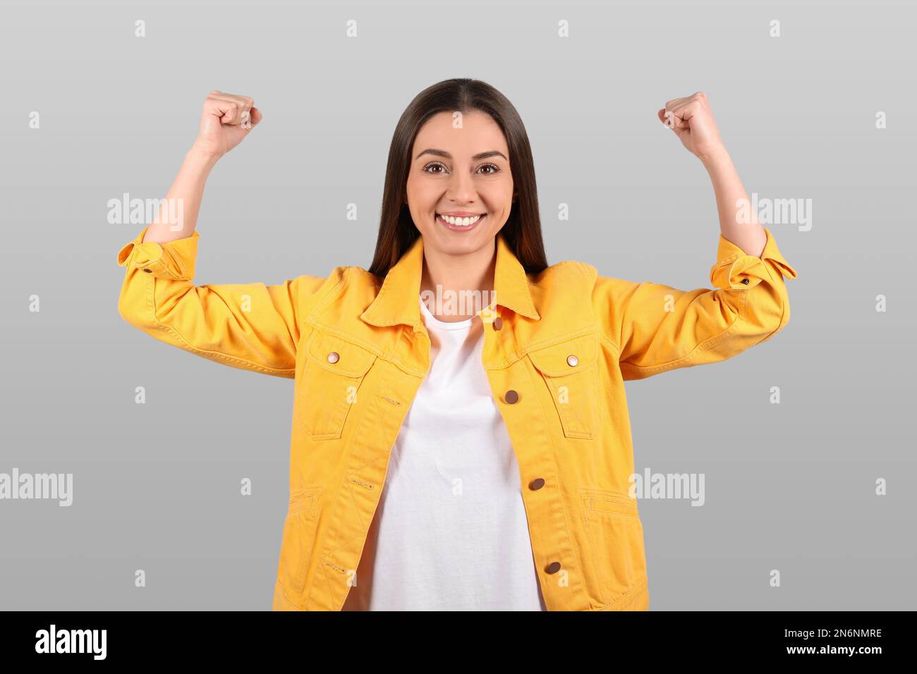 Strong woman as symbol of girl power on light grey background. 8 March ...