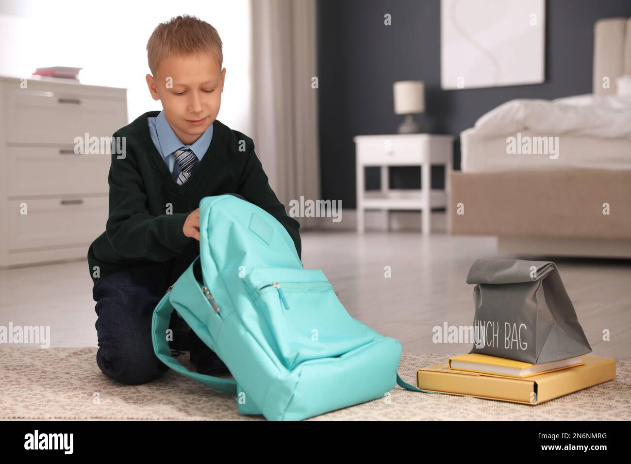 Little boy getting ready for school in bedroom Stock Photo - Alamy