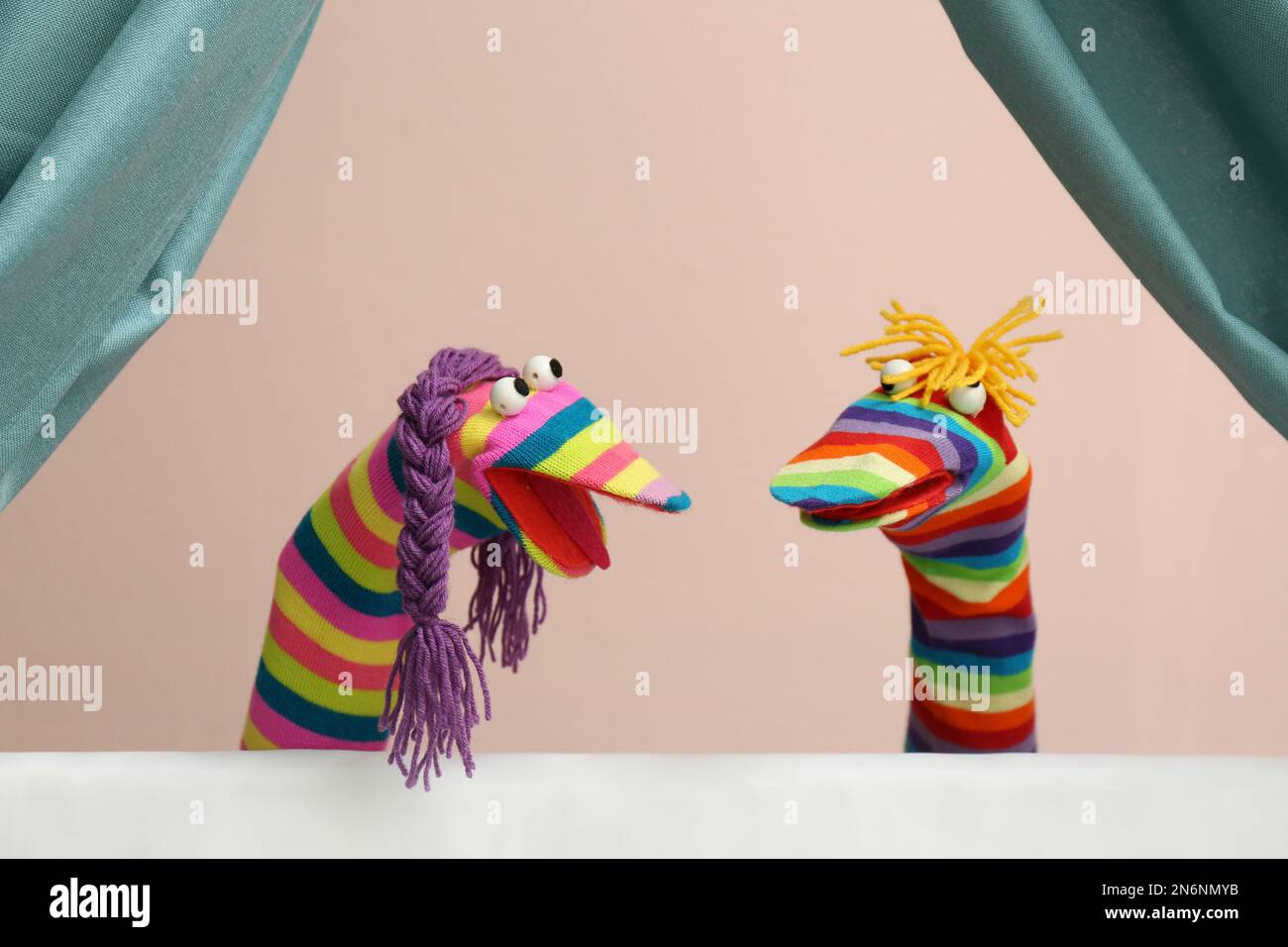 Creative puppet show on white stage indoors Stock Photo - Alamy
