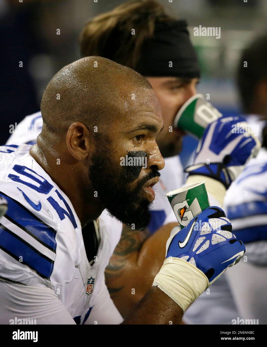 Dallas Cowboys defensive tackle Jason Hatcher (97) sits on the bench ...
