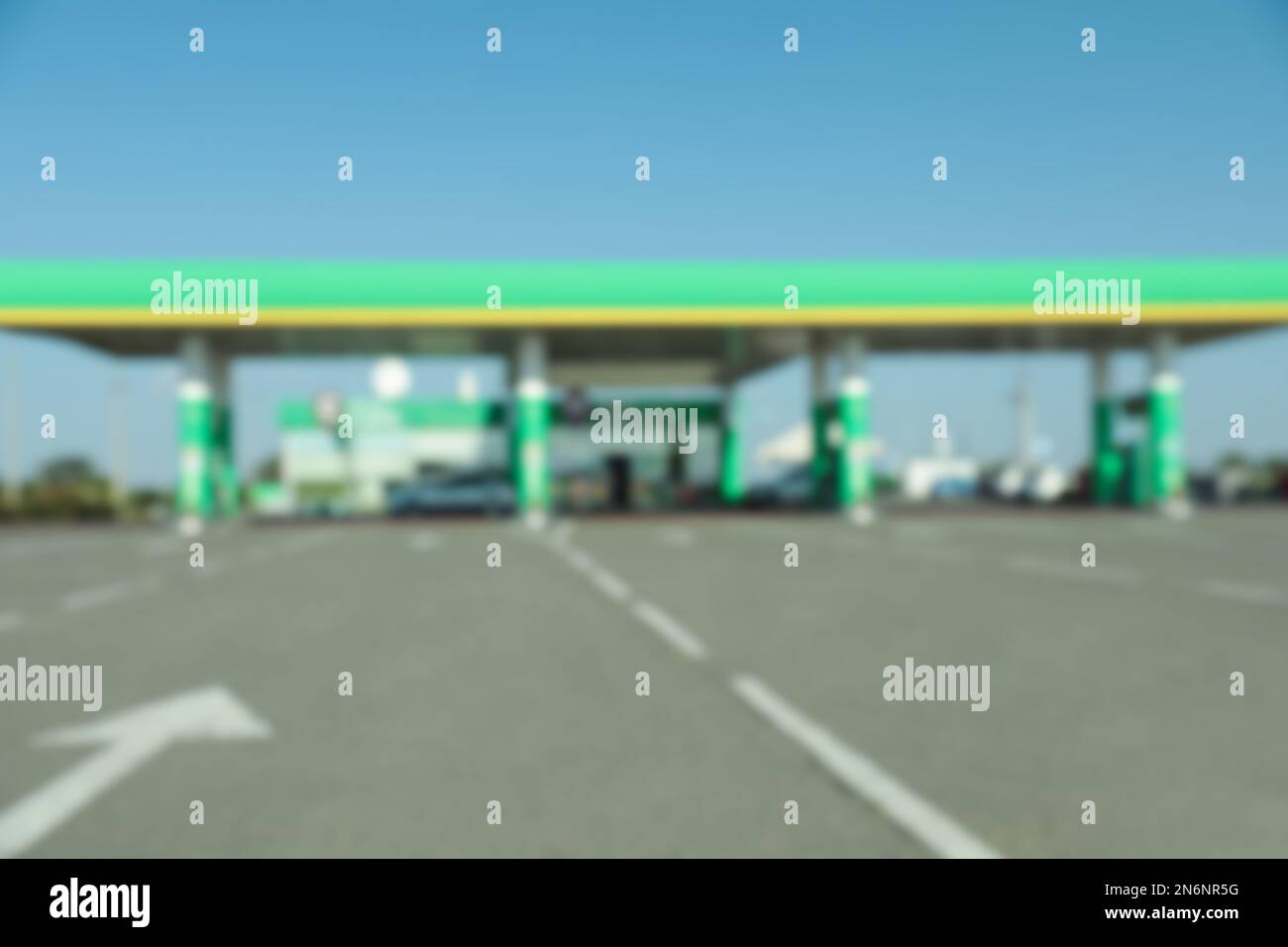 Blurred view of modern gas station with convenience store beside the ...