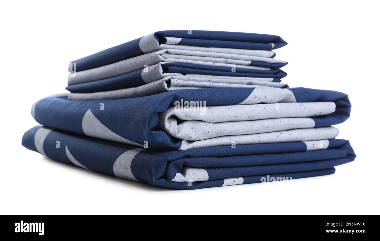 Stack of clean bed linens isolated on white. Child's room interior ...