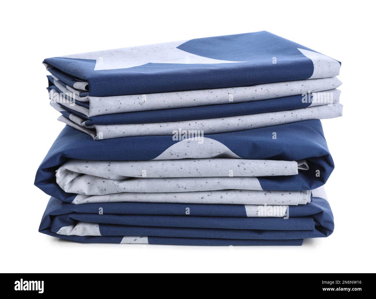 Stack of clean bed linens isolated on white. Child's room interior ...