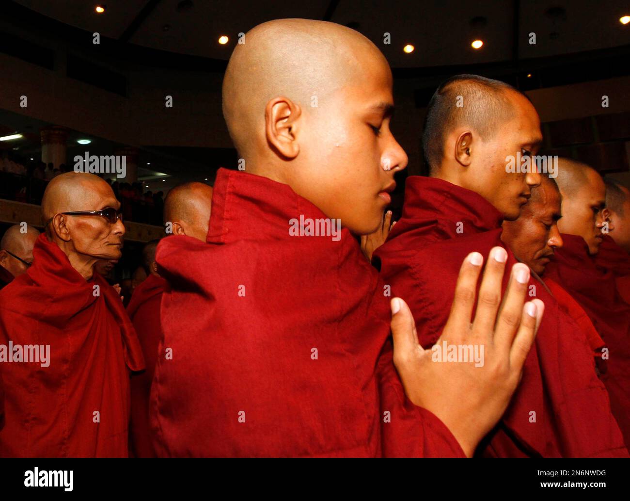 Myanmar Buddhist monks offer prayers during a celebration to mark the ...