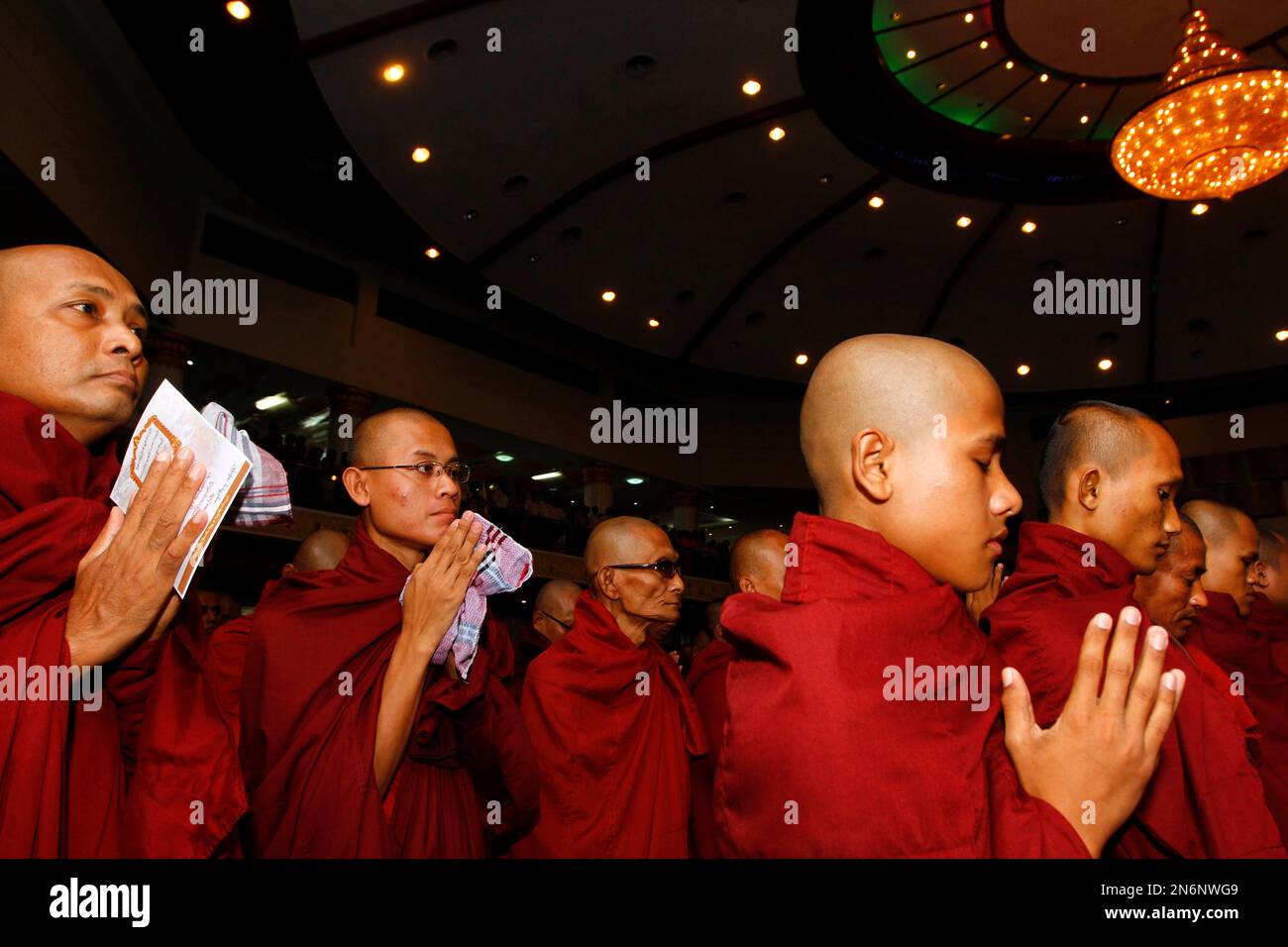 Myanmar Buddhist monks offer prayers during a celebration to mark the ...