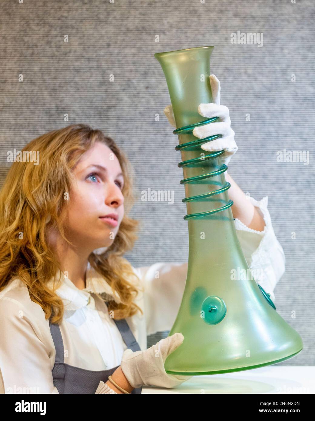 London, UK. 10 February 2023. A technician presents a Tall iridescent ...