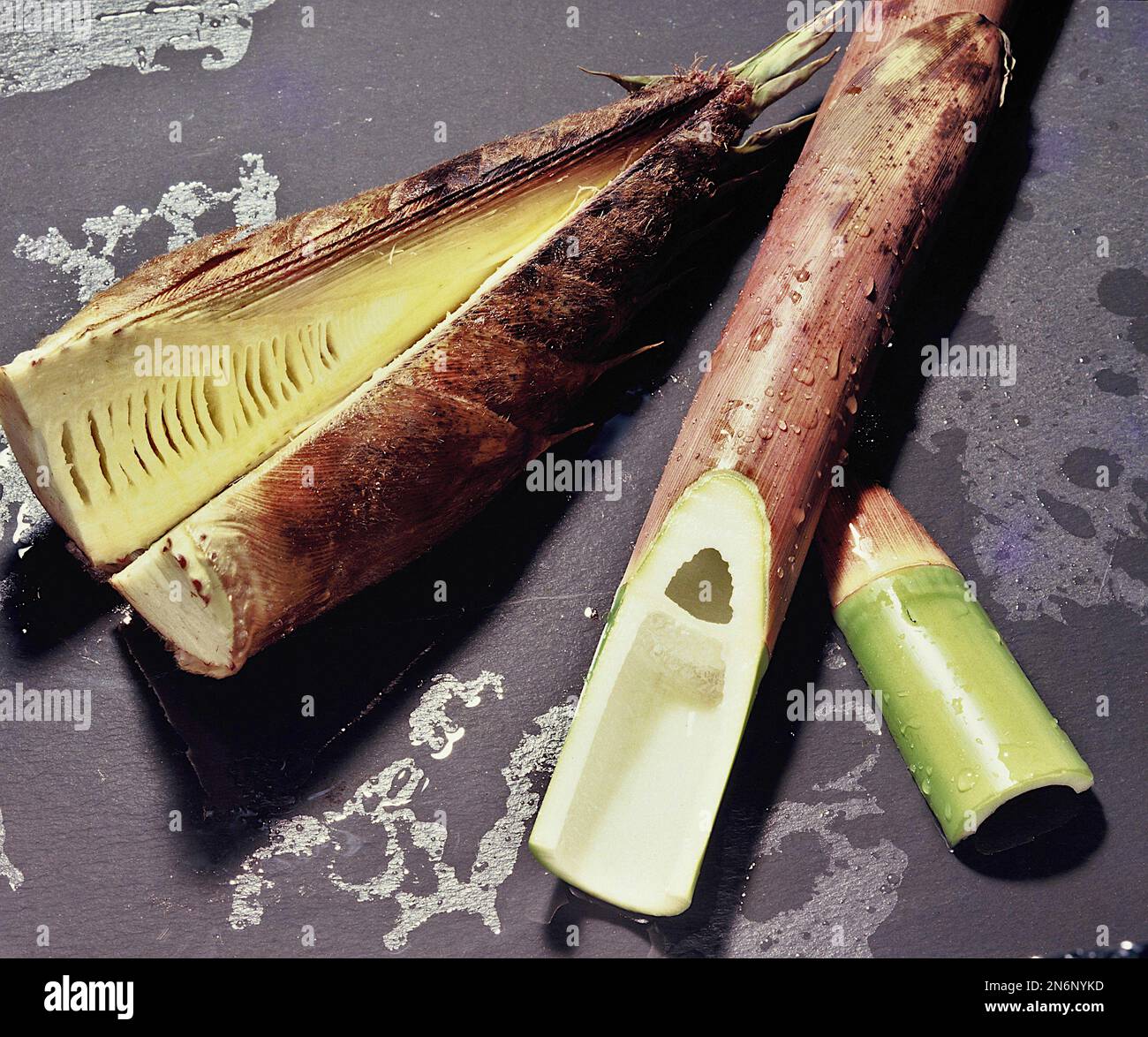 Sliced edible bamboo on a dark stone table top Stock Photo - Alamy