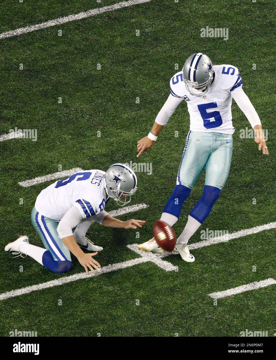 With Dallas Cowboys punter Chris Jones (6) holding, kicker Dan Bailey ...