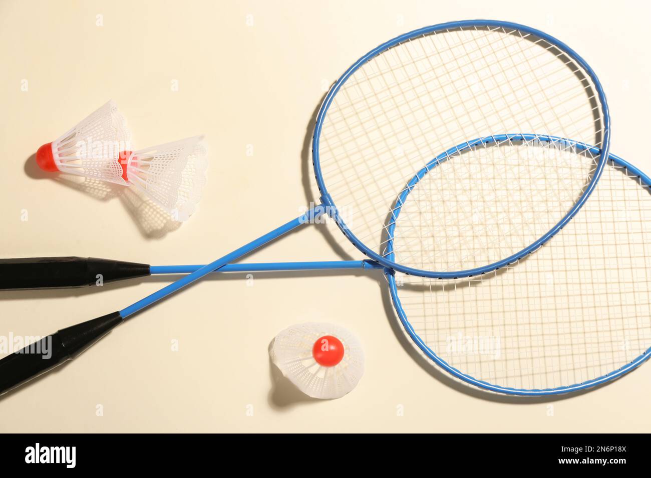 Badminton rackets and shuttlecocks on light background, flat lay Stock ...
