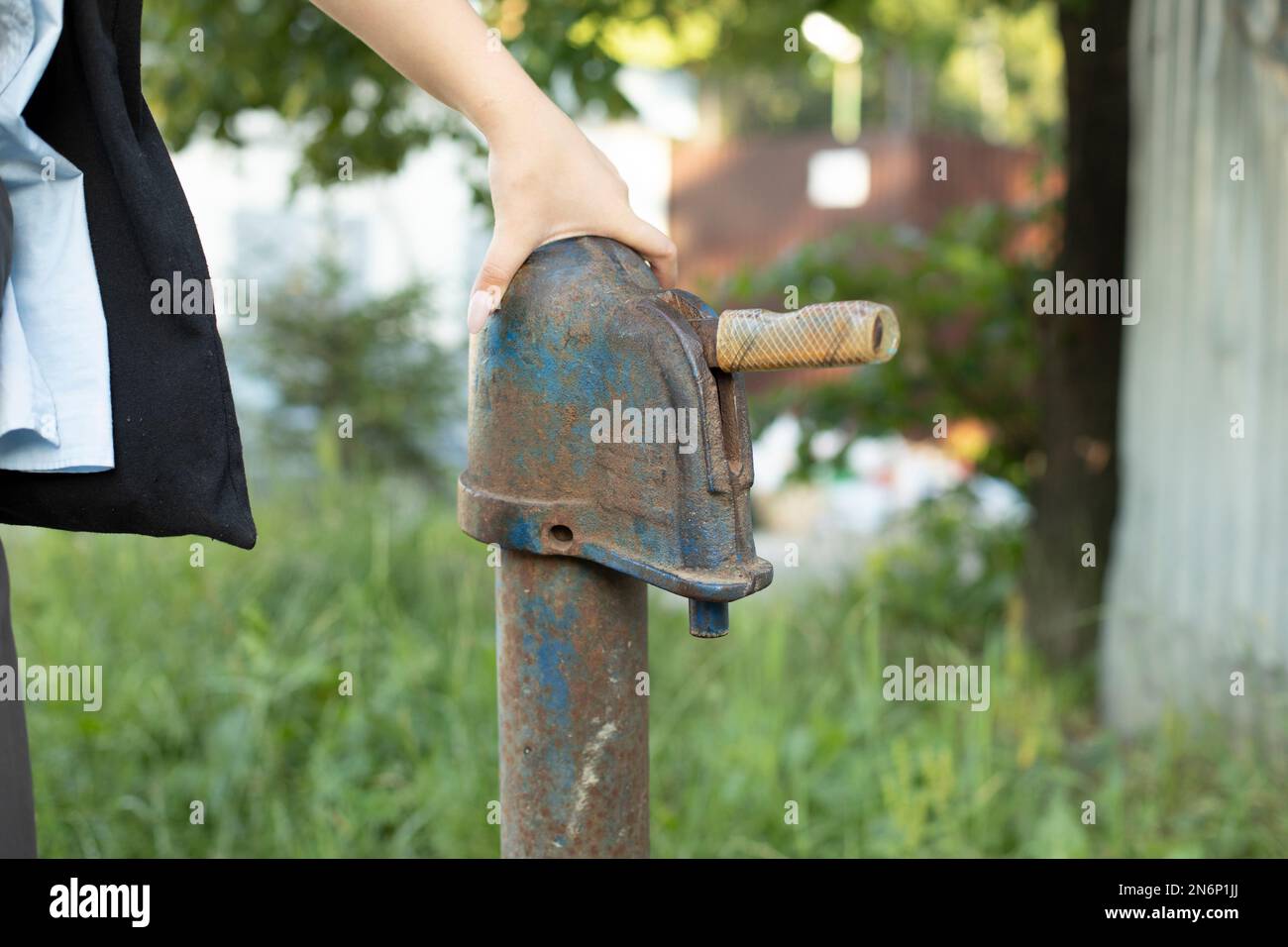 Water column. Groundwater in village. Drinking source. Water tap Stock ...