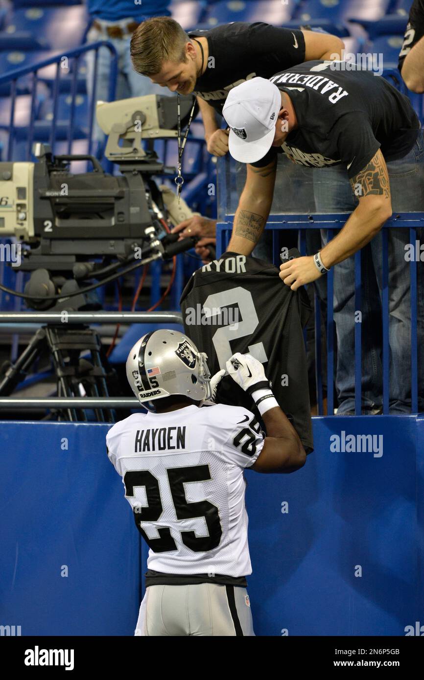 Oakland Raiders cornerback DJ Hayden signs an autograph for a fan ...