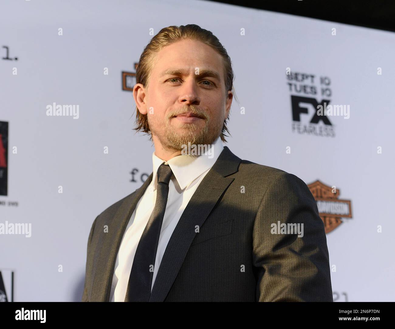 Actor Charlie Hunnam arrives on the red carpet at the season six ...