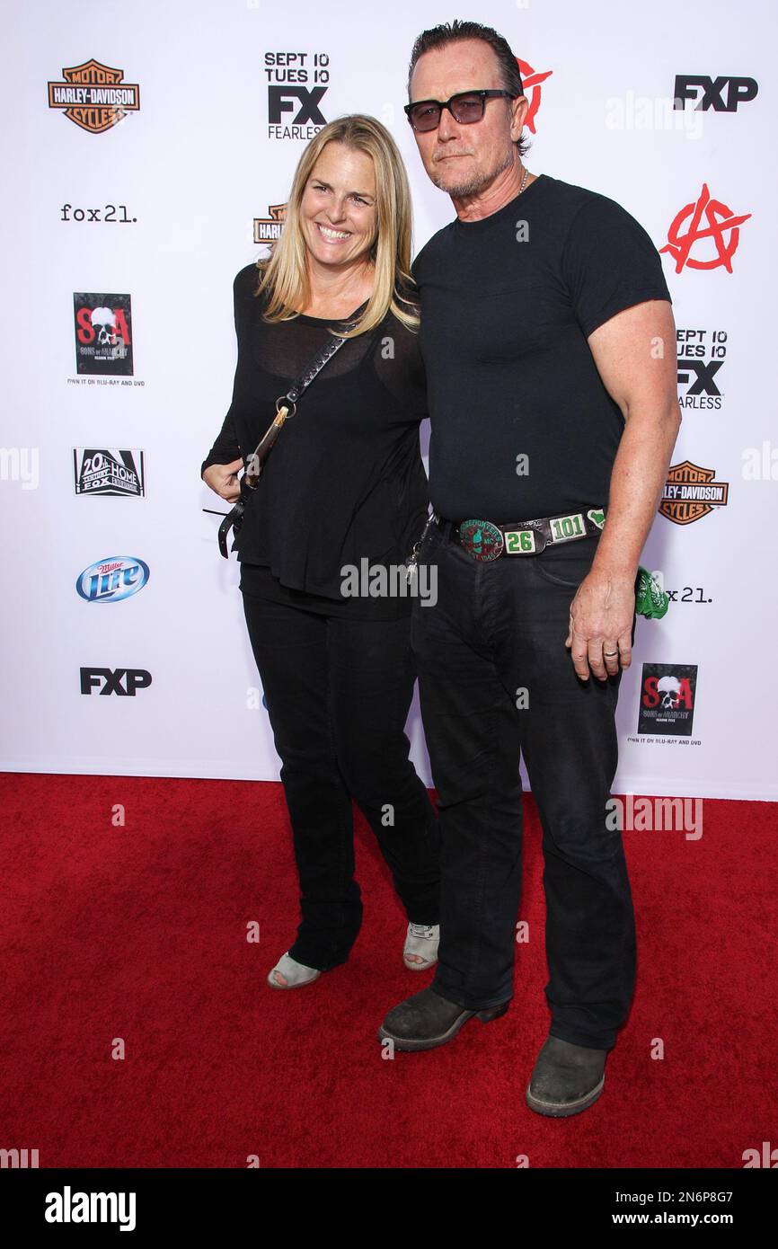 From left, Barbara Patrick and actor Robert Patrick arrive at the ...