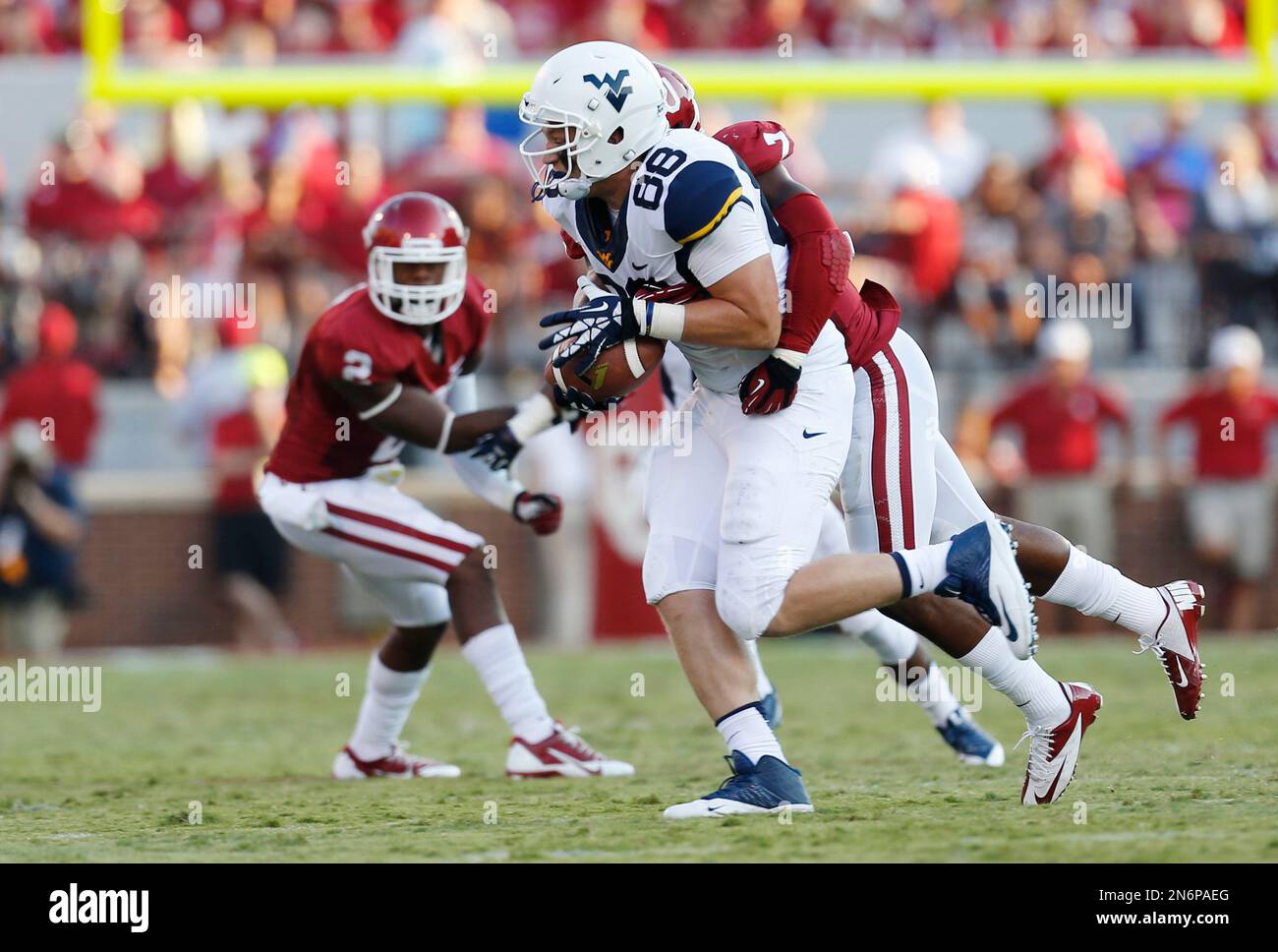West Virginia wide receiver Cody Clay (88) is tackled by Oklahoma linebacker Corey Nelson (7) in ...