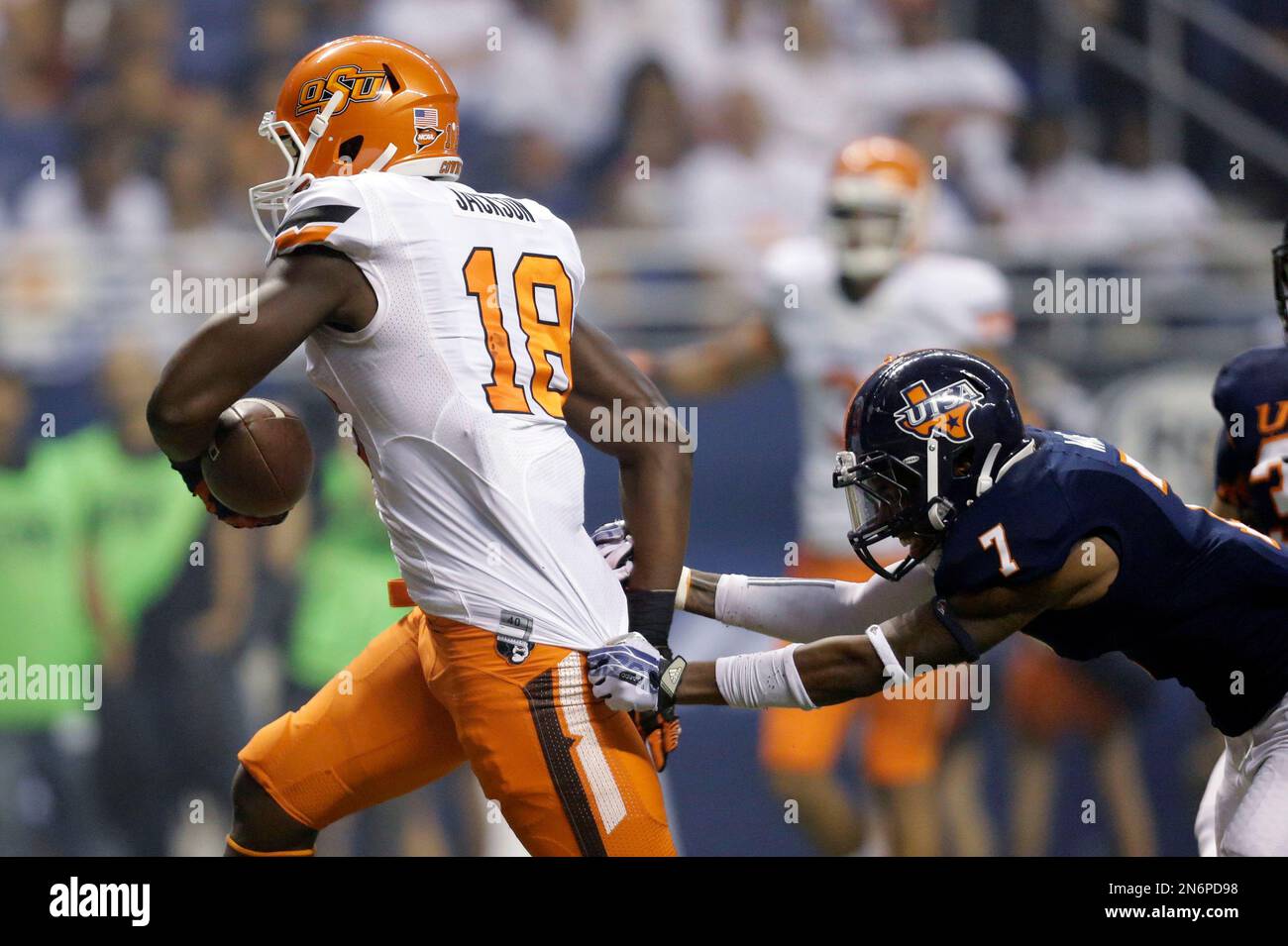 Oklahoma State's Blake Jackson (18) scores a touchdown asTexas San ...