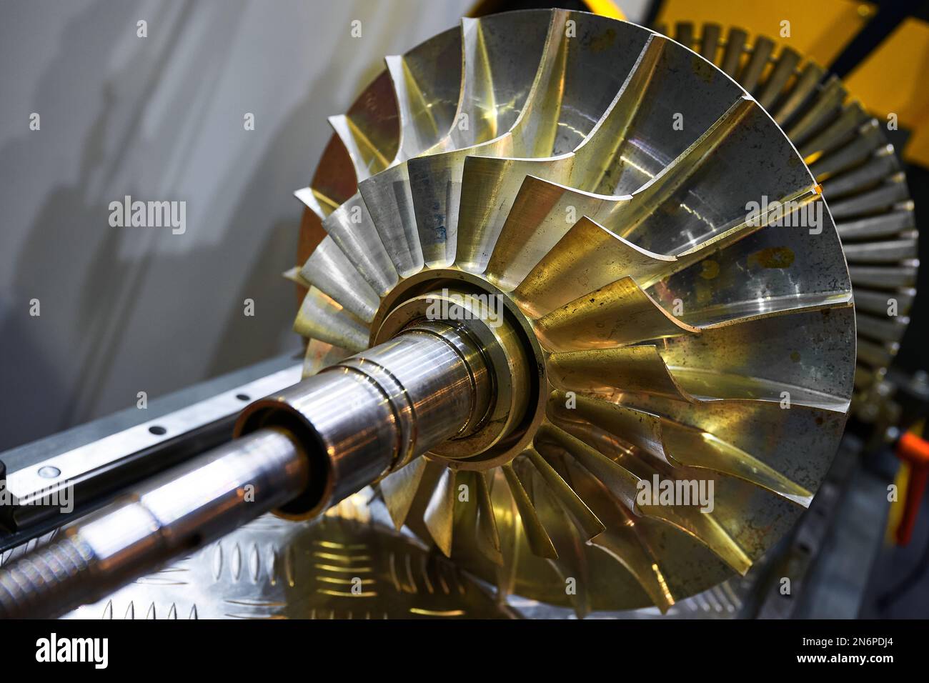 Grey and golden rotor with thin blades on metal rod in shop Stock Photo ...