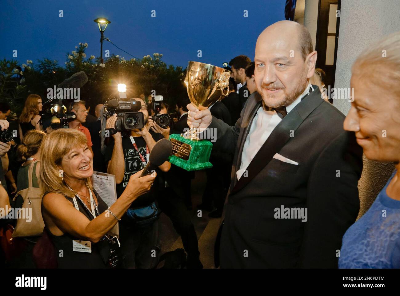 Actor Themis Panou holds his Volpi Cup for Best Actor for his role in ...